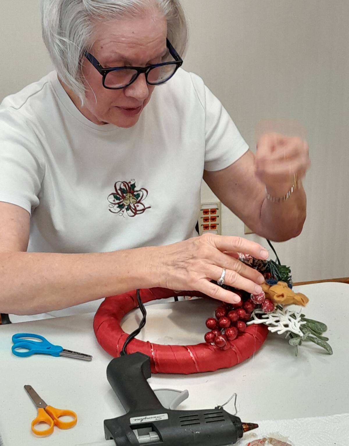 Ms. Gretchen is working hard on her wreath.